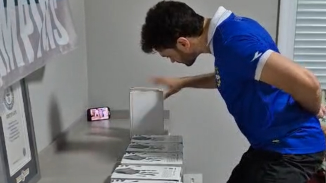 Fastest time to set up and topple 10 books | Guinness World Records