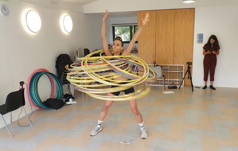 Longest duration spinning 30 hoops simultaneously | Guinness World Records