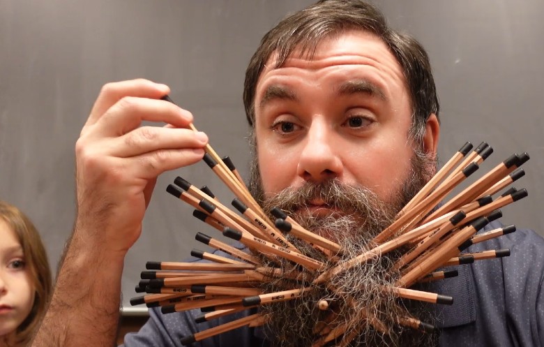 Most pencils put into a beard in one minute | Guinness World Records