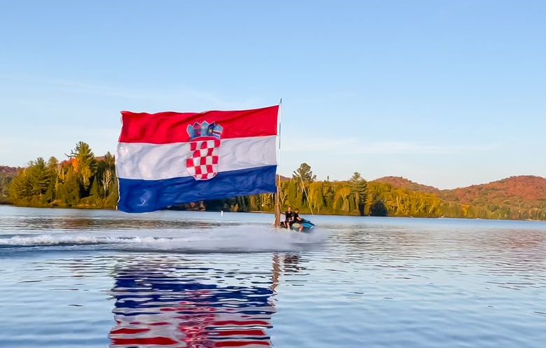 Largest flag flown on a personal watercraft (PWC) | Guinness World Records