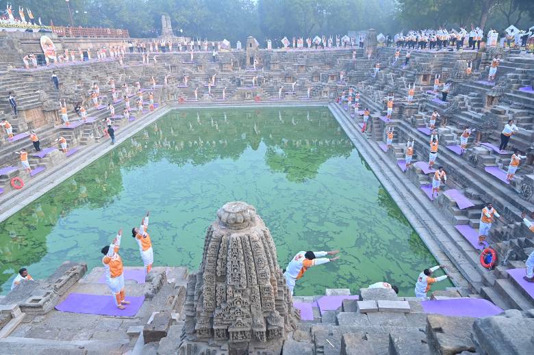 Most people performing sun salutations simultaneously (multiple venues ...
