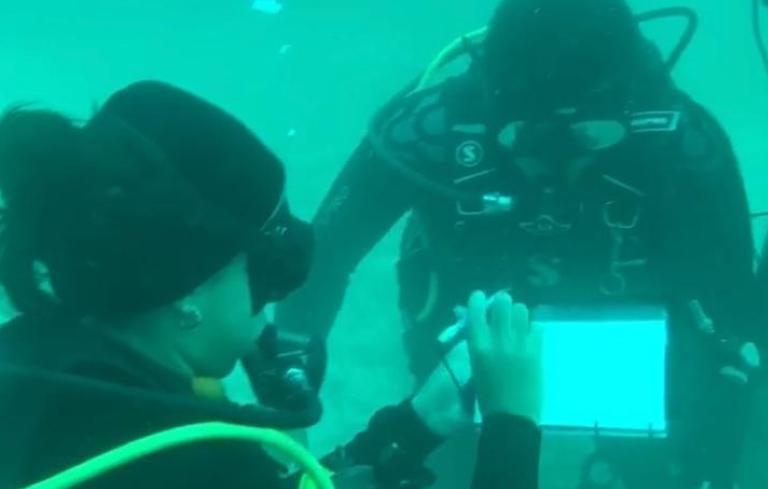 Deepest underwater bank transaction | Guinness World Records