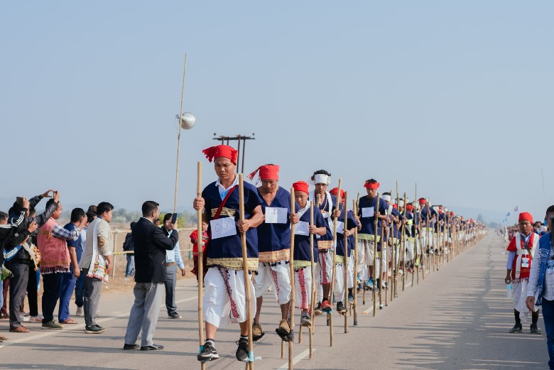 Longest moving line of people walking on stilts | Guinness World Records