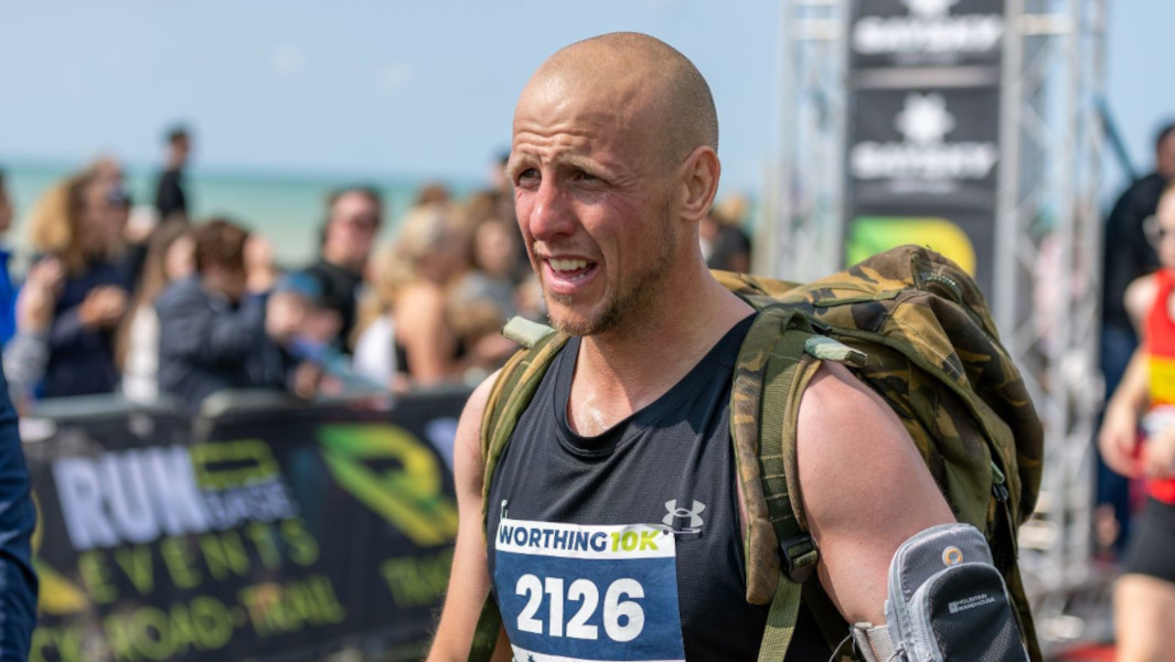 Fastest 10 km run carrying a 20 lb pack (male) | Guinness World Records