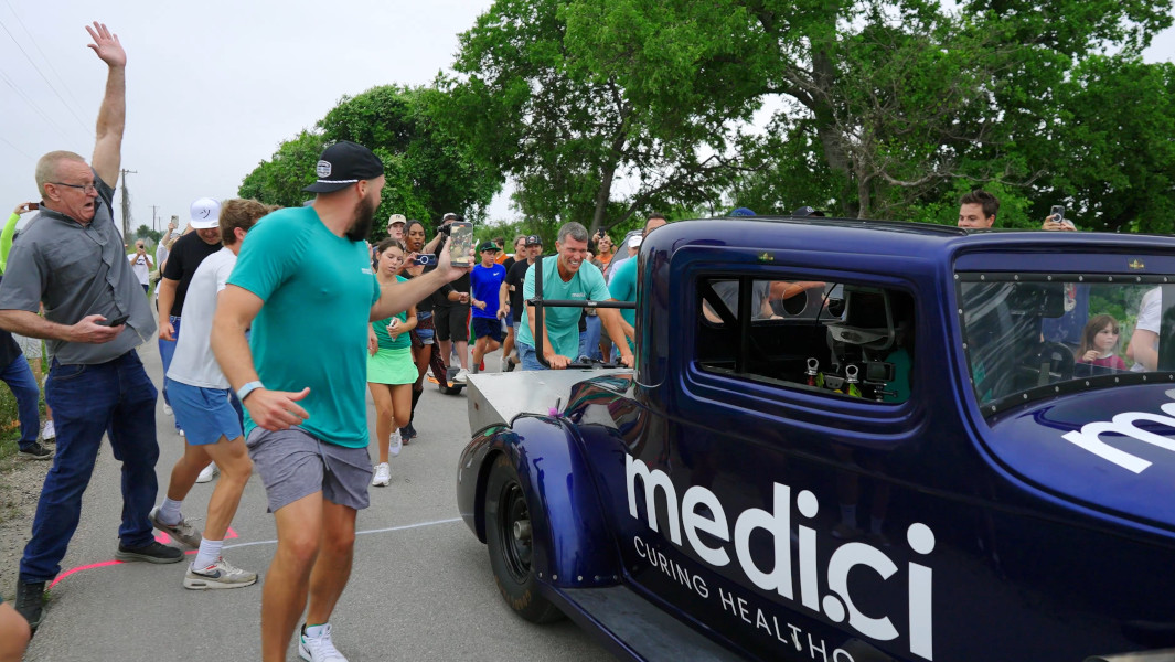 Fastest time to push a car one mile (male) | Guinness World Records