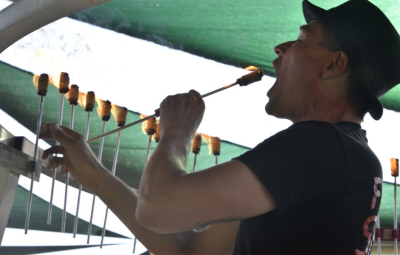 Most torches extinguished by fire eating one minute | Guinness World ...