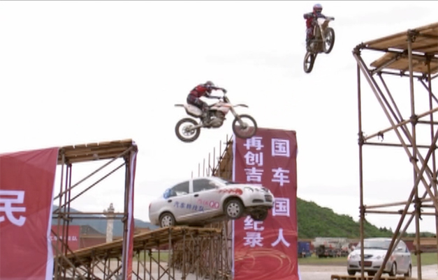 Most motorised vehicles doing ramp jump crossing mid-air | Guinness ...