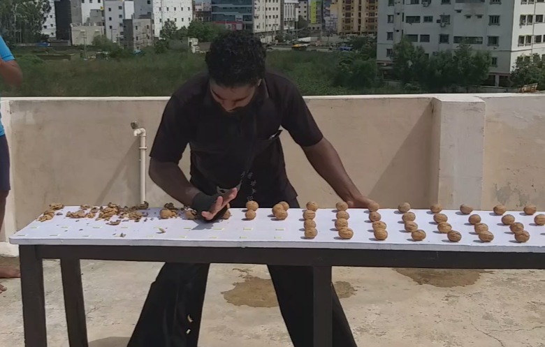 Most walnuts crushed by the hand in one minute | Guinness World Records